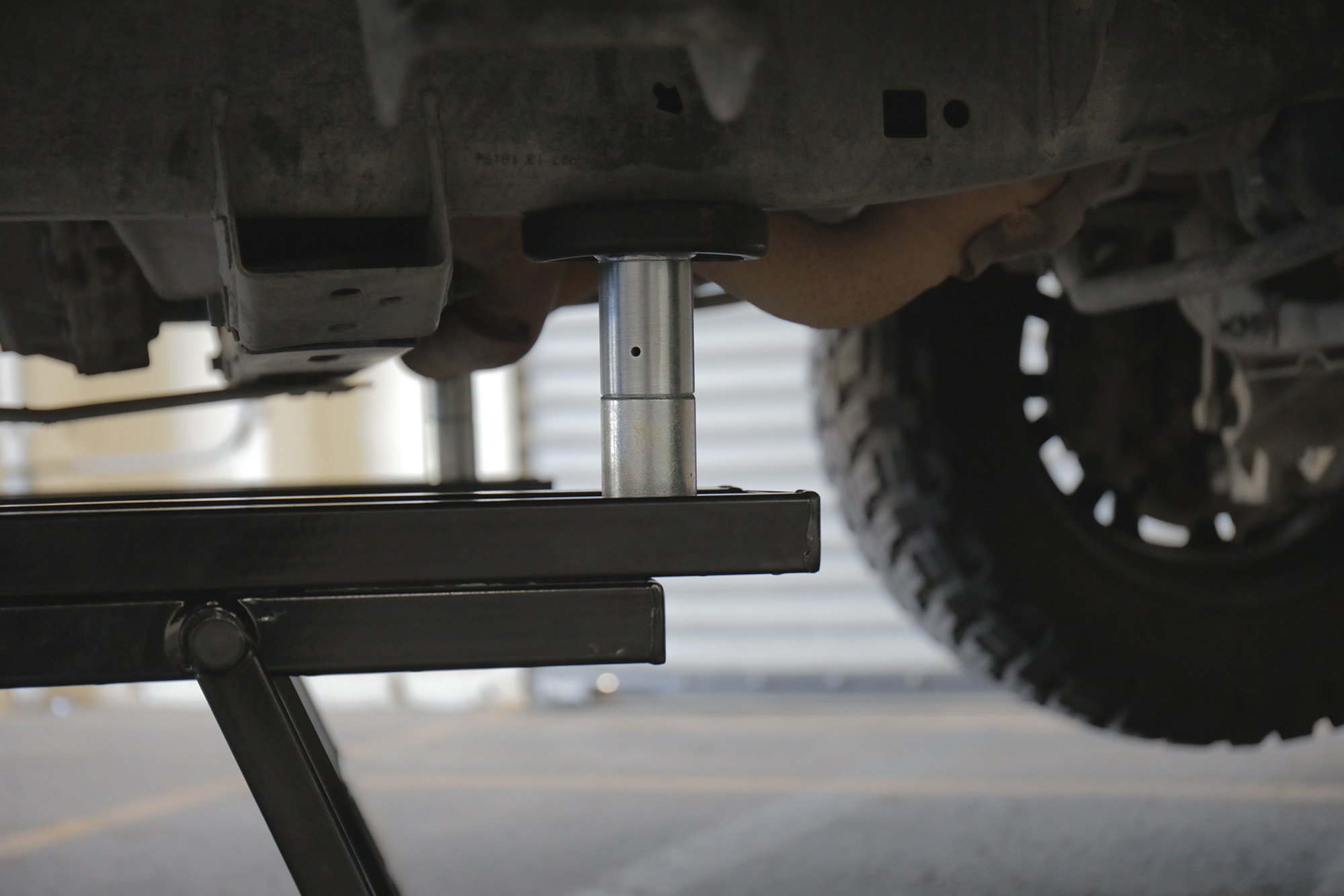 QuickJack system lifting a large vehicle with SLX extensions installed ...